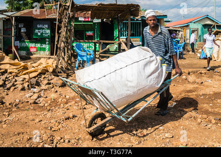 Man with wheelbarrow, Kenya, Africa Stock Photo - Alamy