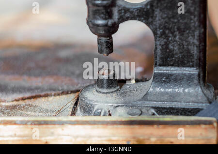Vintage hand-press for setting rivets on clothes. The shoemaker's ...