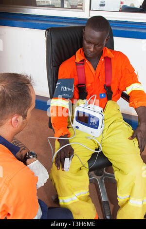 Paramedic from emergency response team check fire fighter after ...