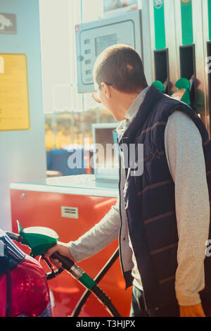 A person fills up their car at a gas station in Montreal on Thursday ...