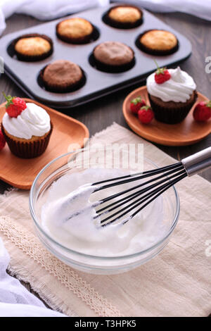 Meringue in a wooden bowl on a blue background. Delicious dessert ...