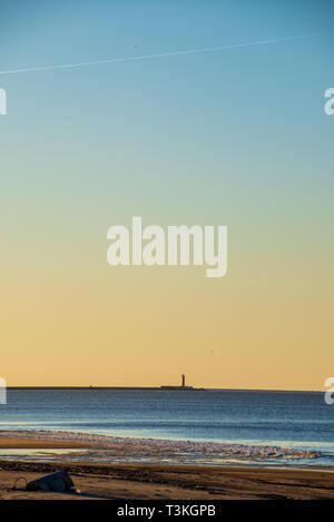 empty sea beach with ice leftovers and no snow in winter Stock Photo ...