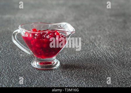 Cranberry sauce in glass gravy boat on the dark background Stock Photo ...