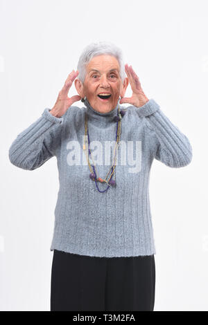 senior woman with expression of forgetfulness or surprise on white ...