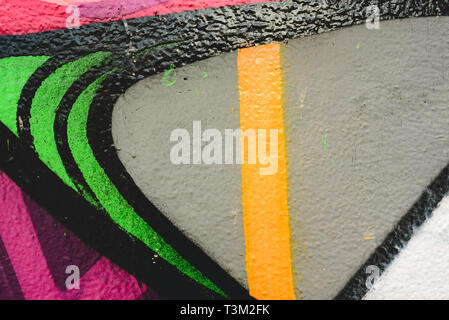 Detail of an anonymous street graffiti with many colors, cheerful urban ...