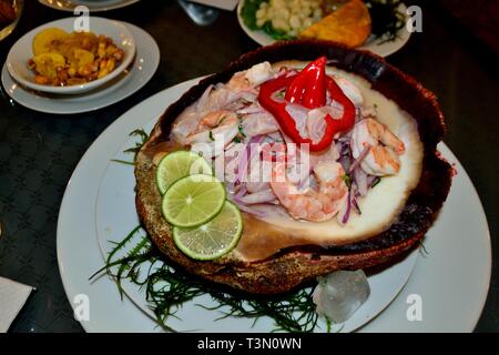 Typical ceviche presented in oyster shell -Restaurant in LIMA ...