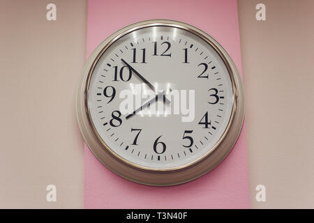 Wall clock show nine o'clock on marble texture. Office clock show 9pm ...