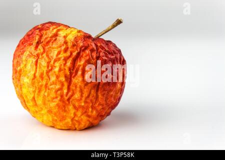 Shriveled apple. Old apple. Wrinkled apple texture. Dry skin. Old ...