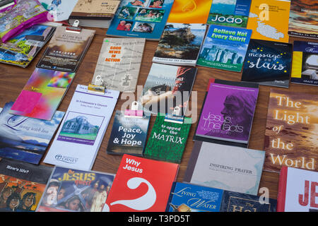 A table with an assortment of religious pamphlets and books Stock Photo ...