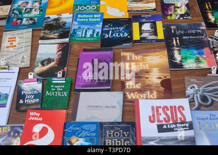 A table with an assortment of religious pamphlets and books Stock Photo ...