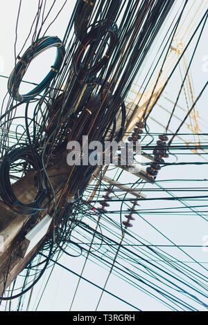 Crazy electric pole with so many cables Stock Photo - Alamy