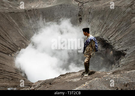 Java, Indonesia - January 17, 2014: Tenggerese Man Standing On The Edge ...