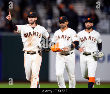 Colorado Rockies' Kevin Pillar, right, scores a run past San Francisco ...