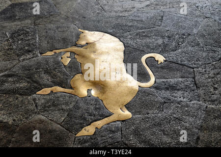 Turin city symbol - the rampant bull. In brass in the stone pavement ...