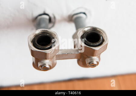 pipes hidden in the wall for radiator mounting system Stock Photo - Alamy