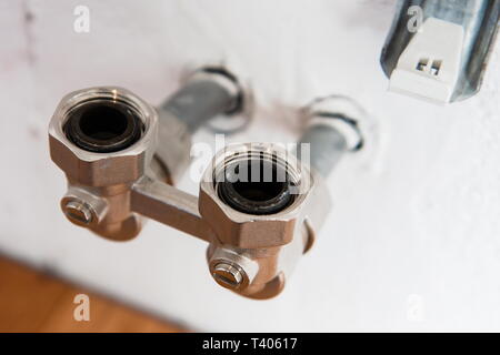 pipes hidden in the wall for radiator mounting system Stock Photo - Alamy