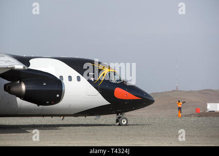 A plane painted like a Macaroni Penguin coming into land at Teniente ...
