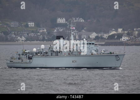 HMS Middleton (M34), a Hunt-class minehunter of the Royal Navy, passes ...