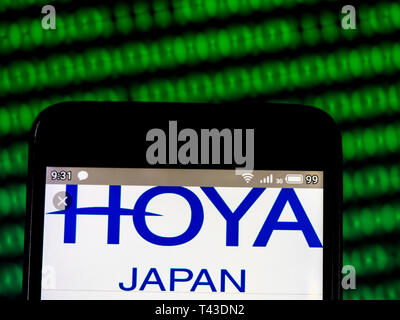 In this photo illustration a Hoya Corporation logo seen displayed on a ...