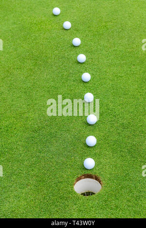 Primary goal of a golf game ... ball has to go into the hole Stock ...