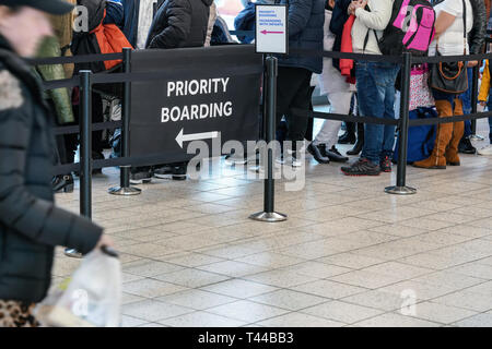 Airport PRIORITY BOARDING sign Stock Photo - Alamy