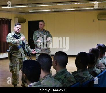Command Sgt. Maj. Roderick Upton, 300th Sustainment Brigade, receives a ...