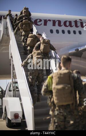 Marines from 14th Marine Regiment, 4th Marine Division standby to board ...
