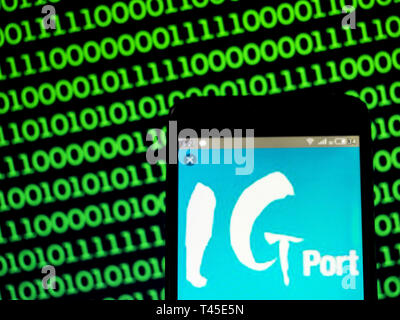 In this photo illustration an IG Port, Inc. logo seen displayed on a ...
