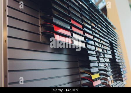 auto paint samples of different colors at car dealership showroom ...