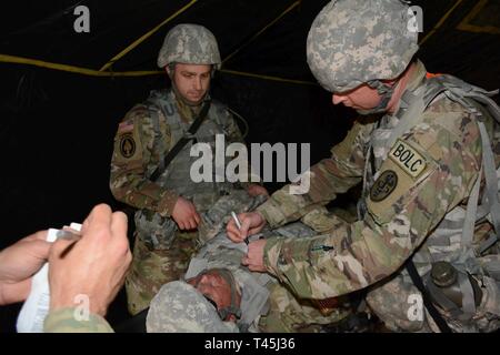 Basic Officer Leadership Couse (BOLC) students undergoing medical ...