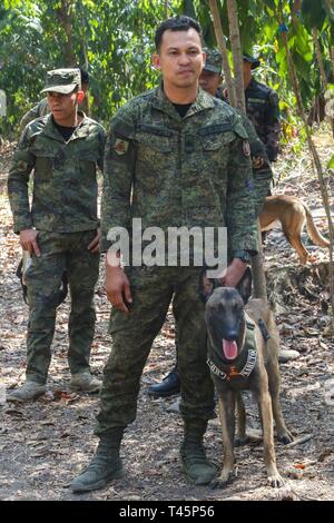 Naruto, a K9 from the Philippine Army, plays with a toy from Sgt Oriel ...