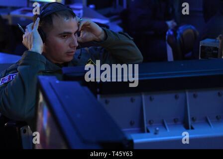 PHILIPPINE SEA (March 11, 2019) Navigation officer, Lt. Jordan Yuson ...