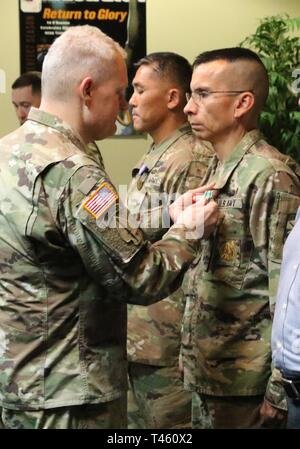 Maj. Gen. John Evans, commander of U.S. Army Cadet Command, presents Victoria Sanelli with a two ...