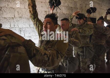 Soldiers exit a CS gas chamber, Jan. 9, during quarterly Chemical ...