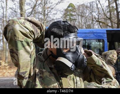A U.S. Soldier assigned to 554th Military Police Company looks on as a ...