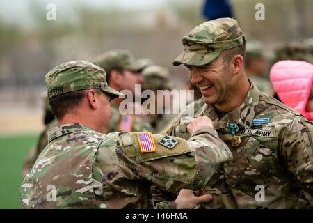 Pinning a Soldier by 1st Armored Division and Fort Bliss Stock Photo ...