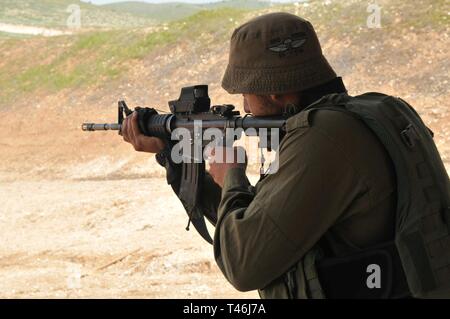 An Israeli Defense Forces soldier fires his M4 carbine during joint ...
