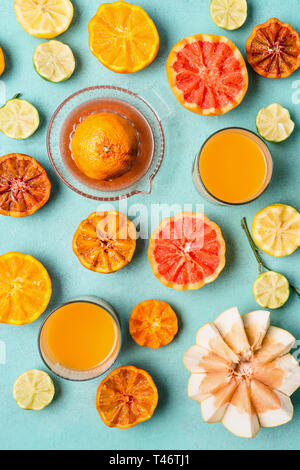 Glasses of lemon juice on light wooden background Stock Photo - Alamy