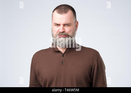 sad mature guy with beard isolated on white background, fashion model ...