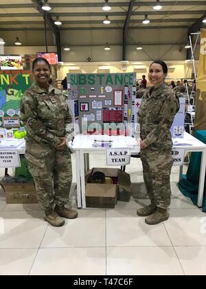 Sgt. Kayla Baker, 657th Movement Control Team, receives a coin for ...