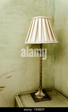Decorative vintage lamp on top of a table with the light on Stock Photo ...
