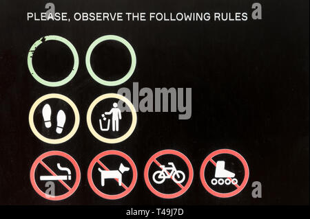 sign observe the following rules on dark background Stock Photo - Alamy