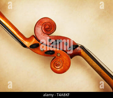 Two old violin scrolls detail over grunge background Stock Photo - Alamy