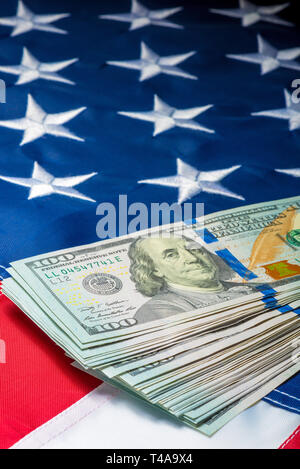 Bunch of United States dollar money with flexing muscle biceps on blue ...
