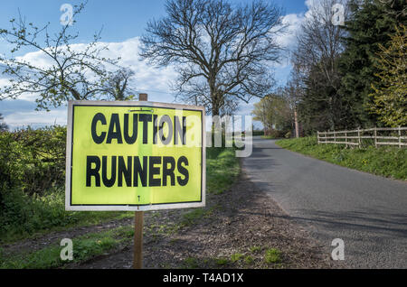 Caution runners sign Stock Photo - Alamy
