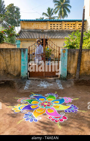 Decorative rangoli (traditional floor art) design made with colourful ...
