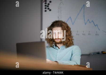 Businessman working overtime long hours late in office Stock Photo - Alamy