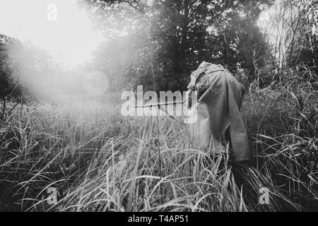 Union Army soldier running with rifle, Civil War reenactment, near ...