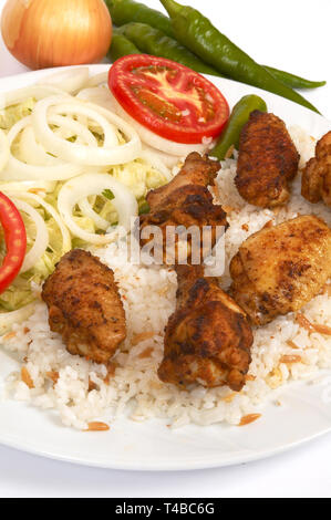 Chicken wings with rice and salads Stock Photo - Alamy