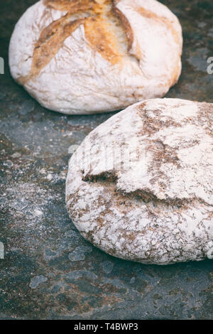 Fresh rustic sourdough loaves on a wooden shelf. High quality photo ...